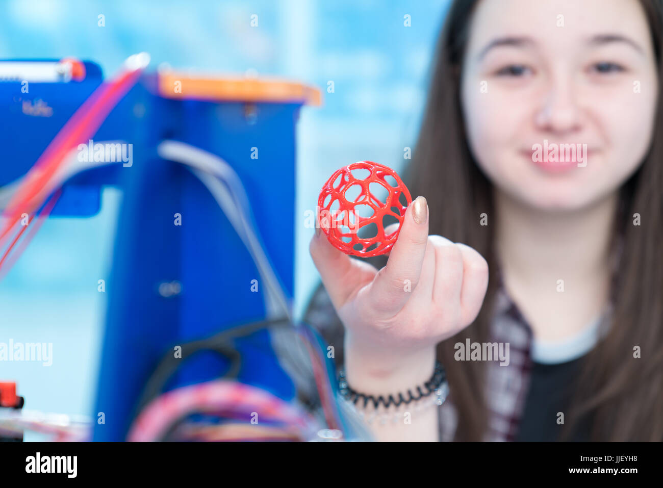 Girl prints 3d model on 3d printer Stock Photo - Alamy