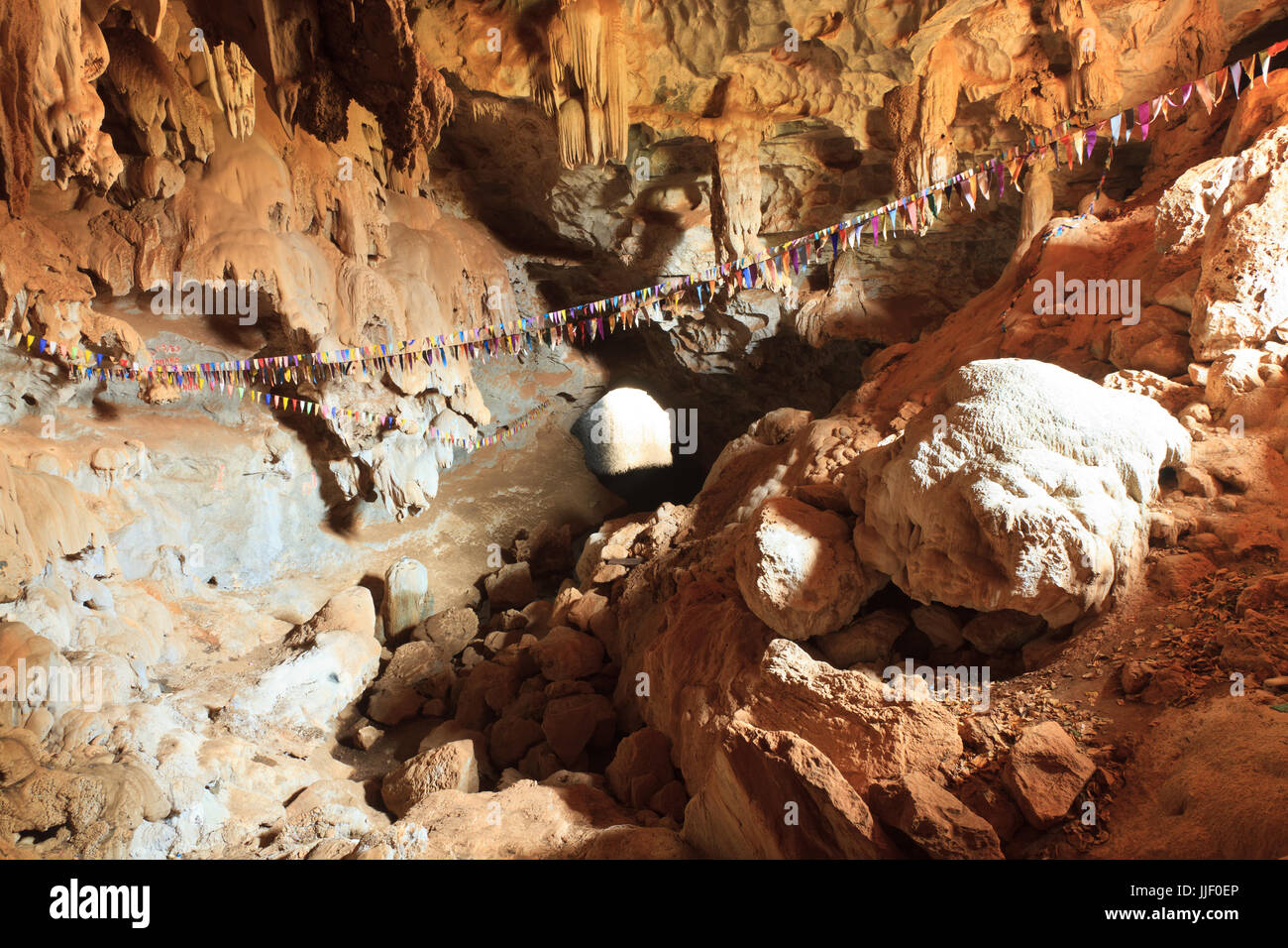 Buddhist Prayer Flags in a cave in Laos Stock Photo - Alamy