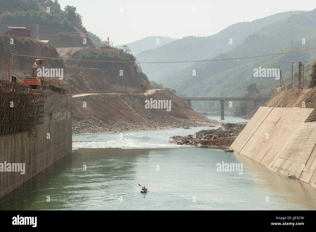 Robert Hahn paddles his packraft through a diversion channel (box dam ...