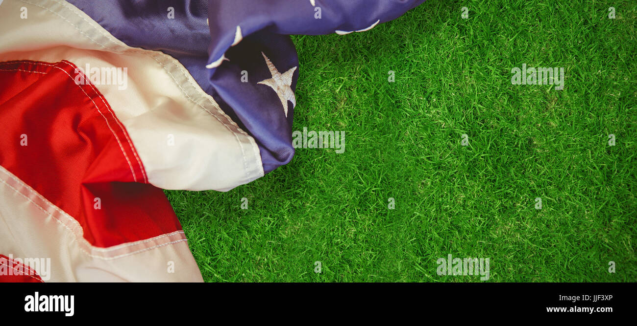 Creased US flag against closed up view of grass Stock Photo - Alamy