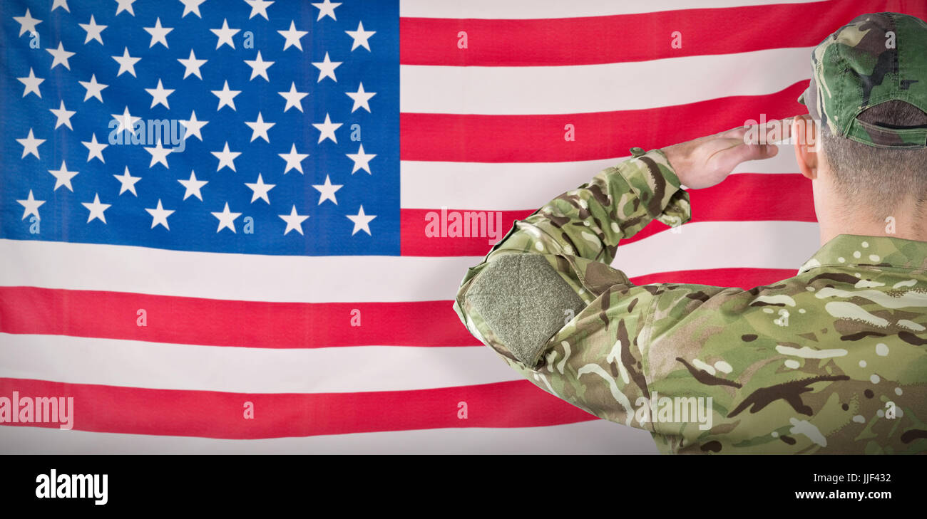 Rear view of soldier saluting against rippled us flag Stock Photo - Alamy