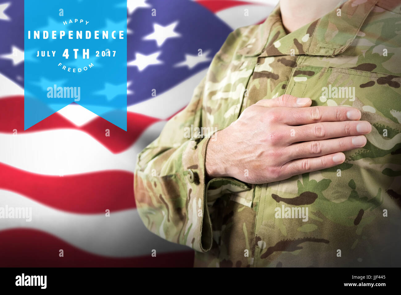 Mid section of soldier in uniform taking oath against focus on usa flag ...