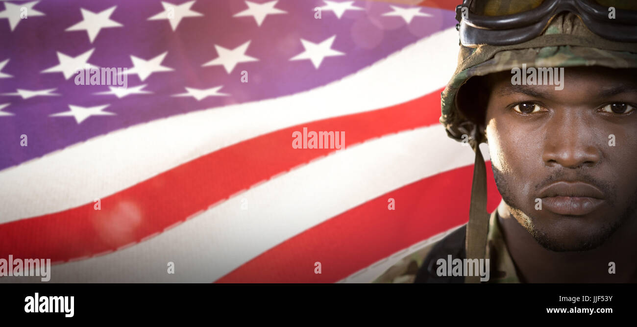 Close up portrait of confident soldier against waving flag of america ...