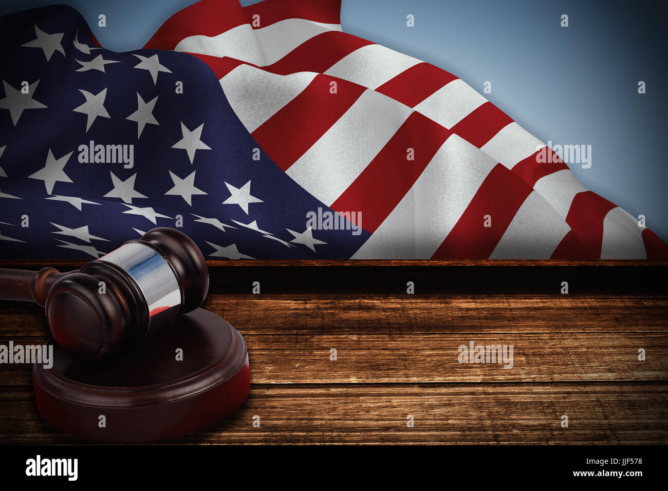 Hammer and gavel against purple vignette Stock Photo - Alamy