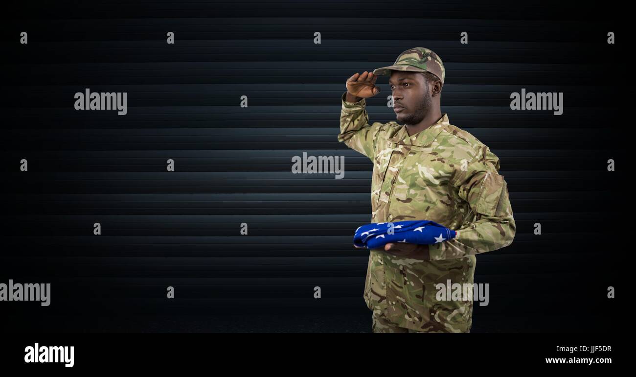 Digital composite of soldier saluting with the USA flag in his hand ...