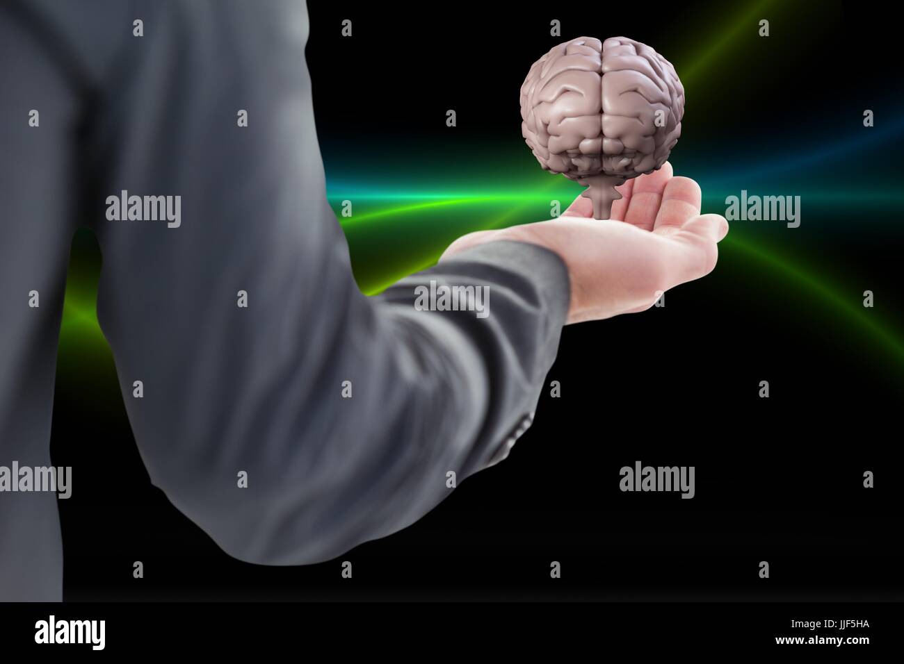 Digital composite of Business man holding a brain on his hand against ...