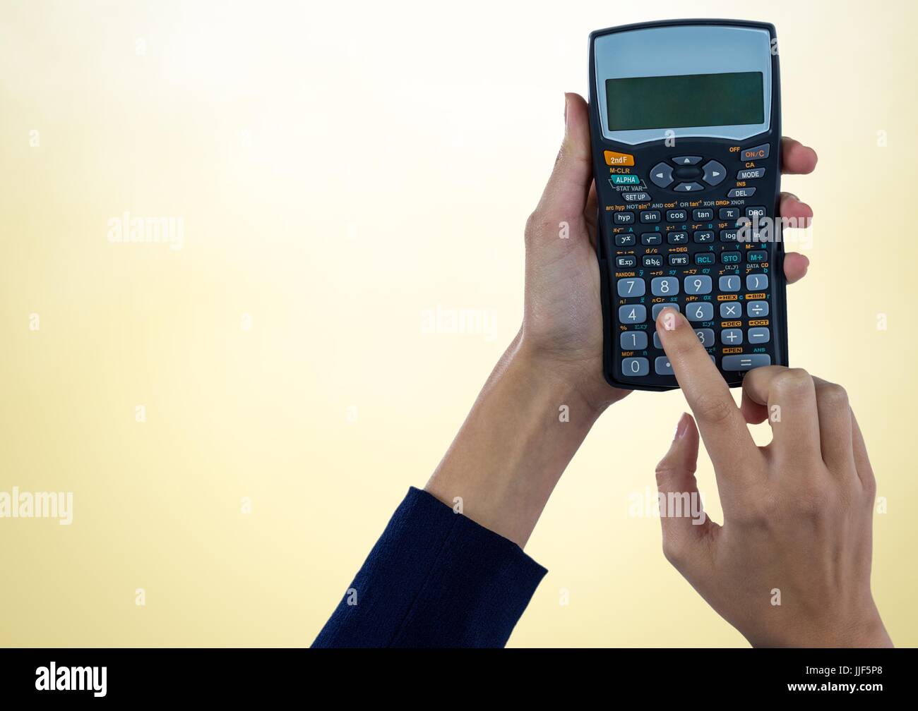 Digital composite of Hands with calculator against yellow background ...