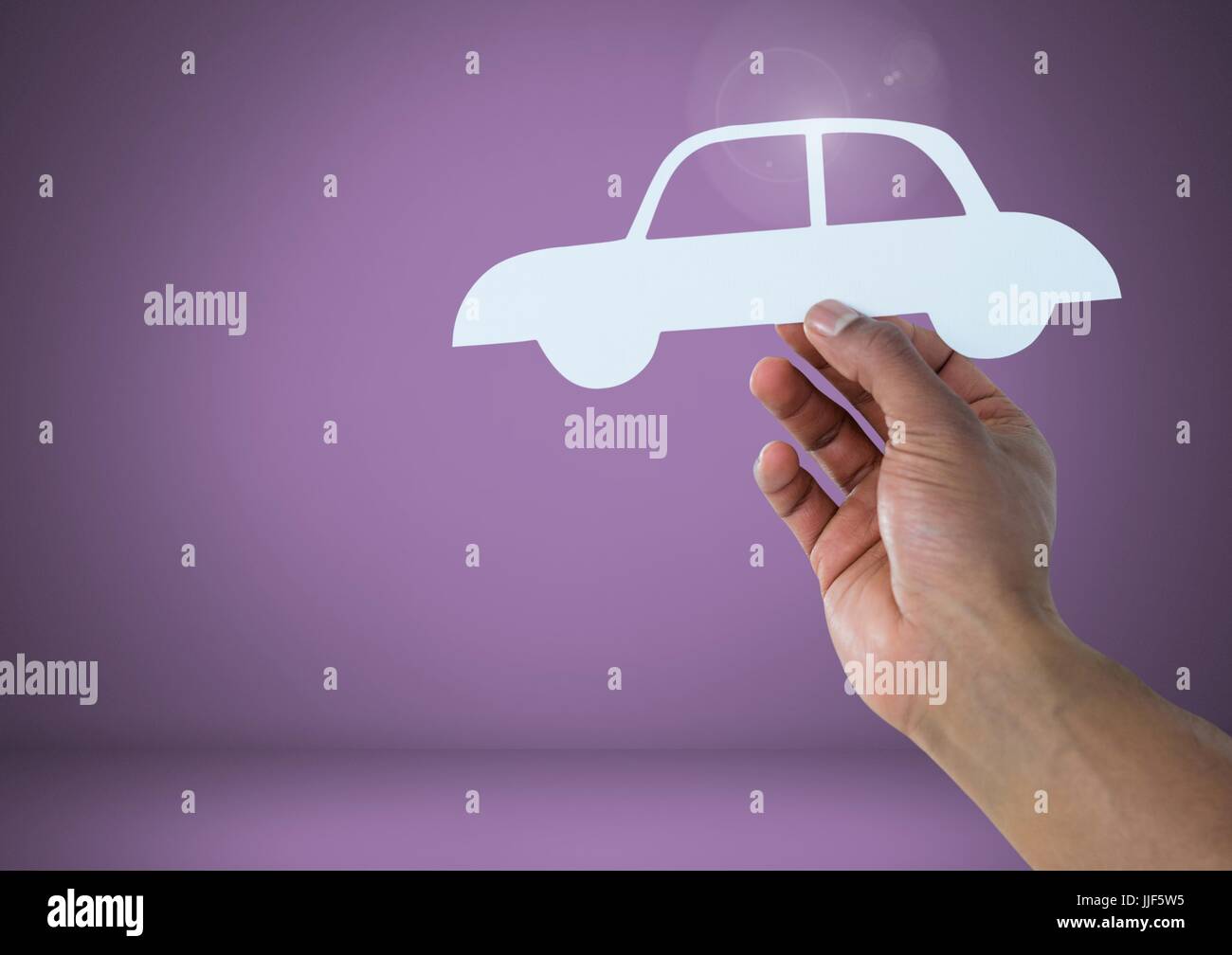 Digital composite of Cut out car in hand Stock Photo - Alamy