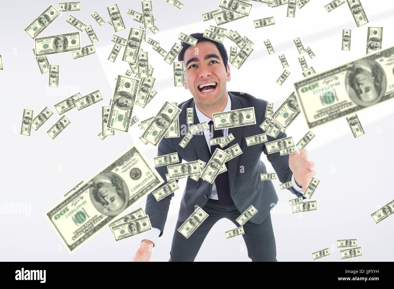 Digital composite of business man with falling money Stock Photo - Alamy