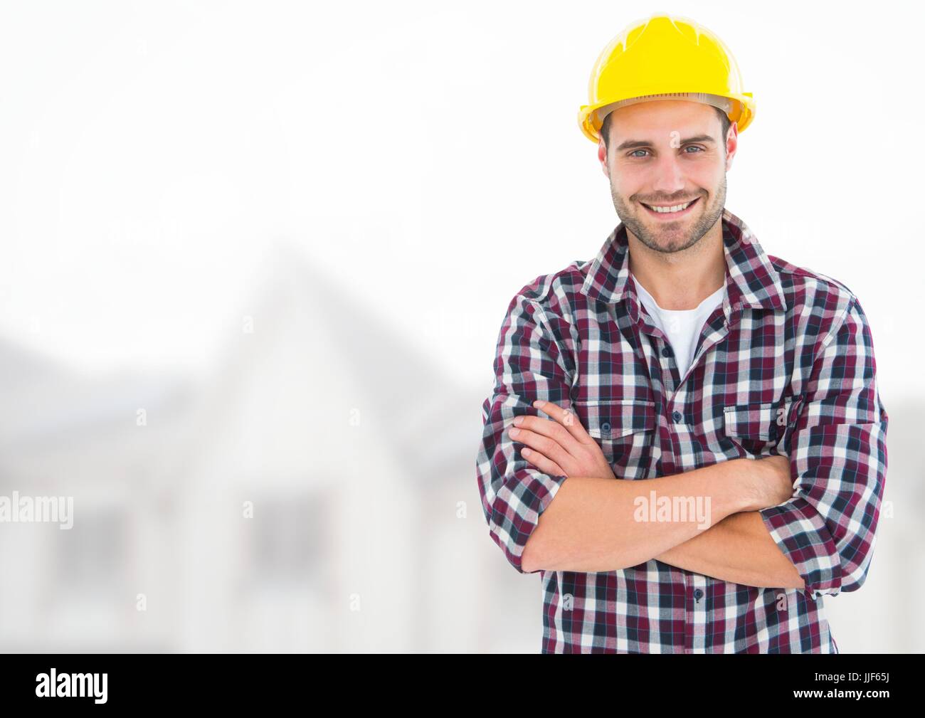 Digital composite of Construction Worker in front of construction site ...