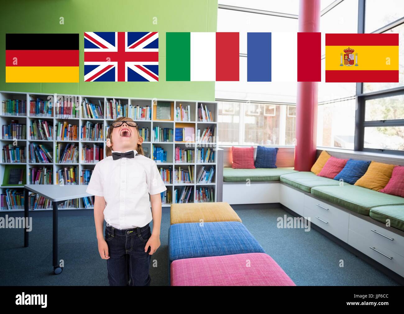 Digital composite of main language flags over boy in the school Stock ...
