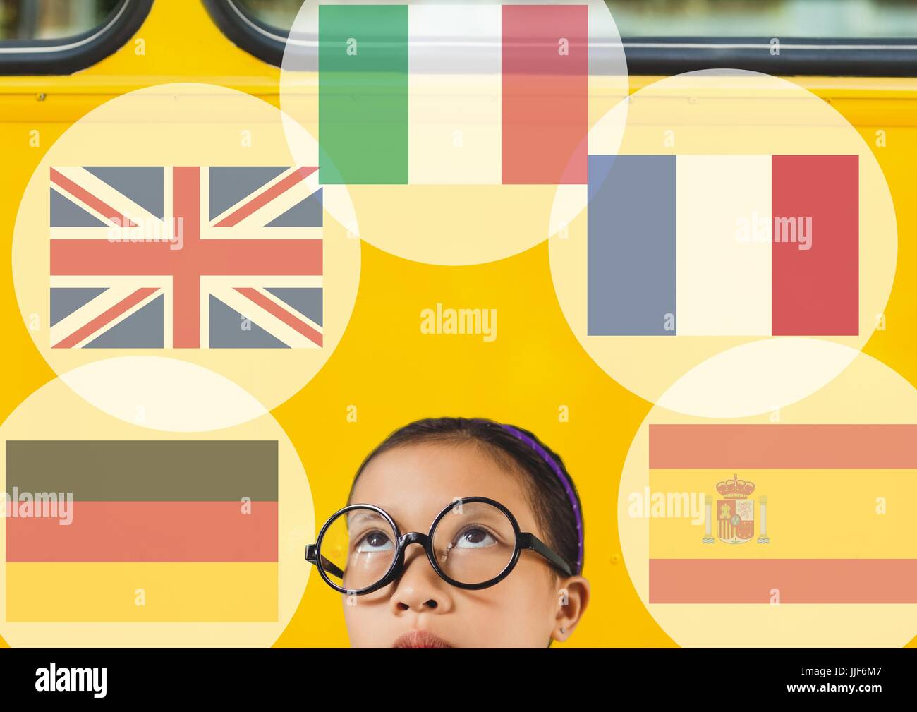 Digital composite of main language flags around girl. School bus ...