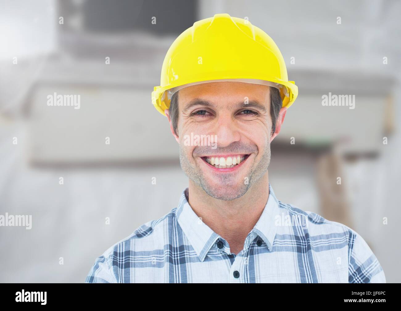 Digital composite of Construction Worker in front of construction site ...
