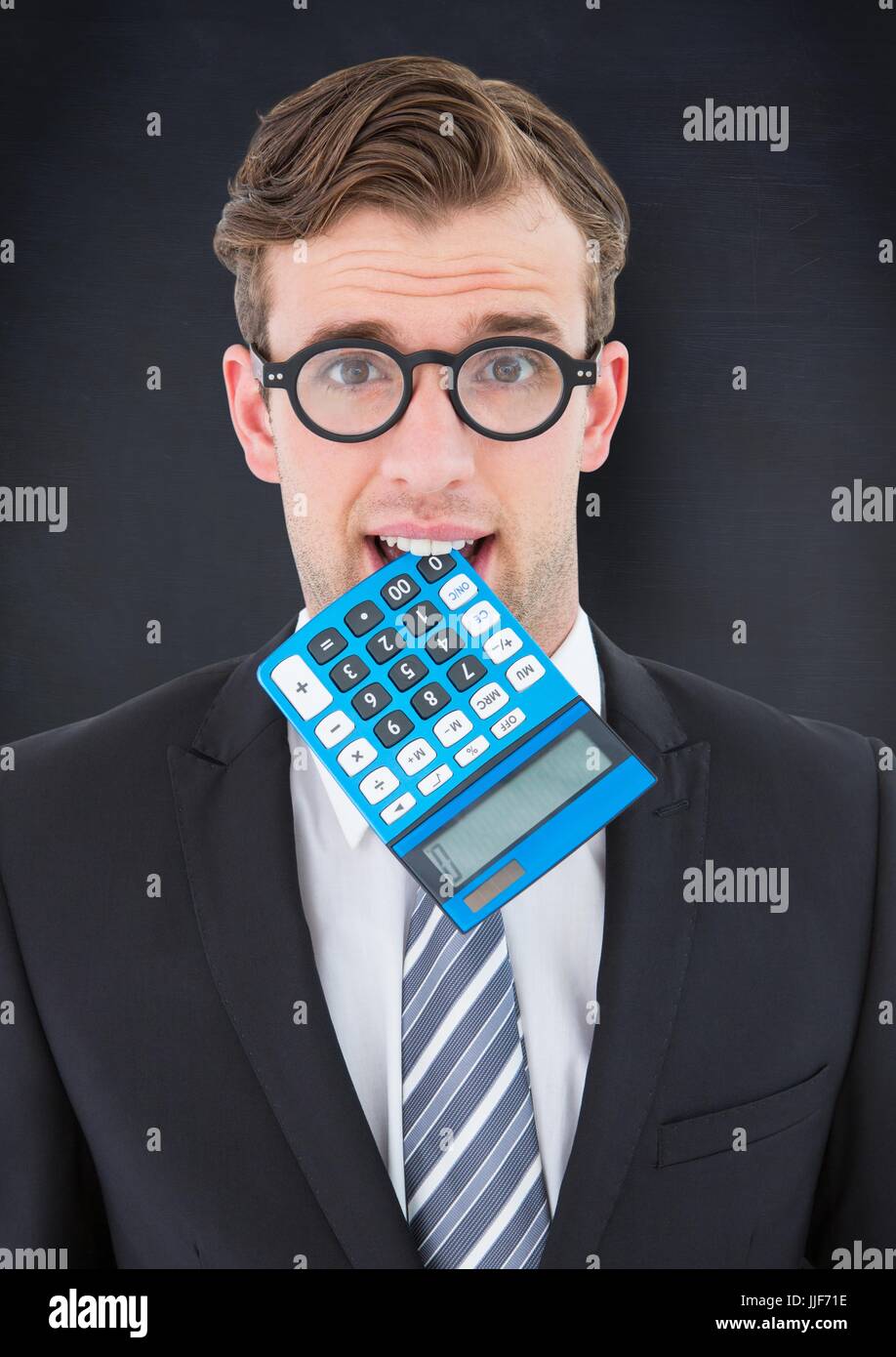 Digital composite of Man with calculator in mouth against navy ...
