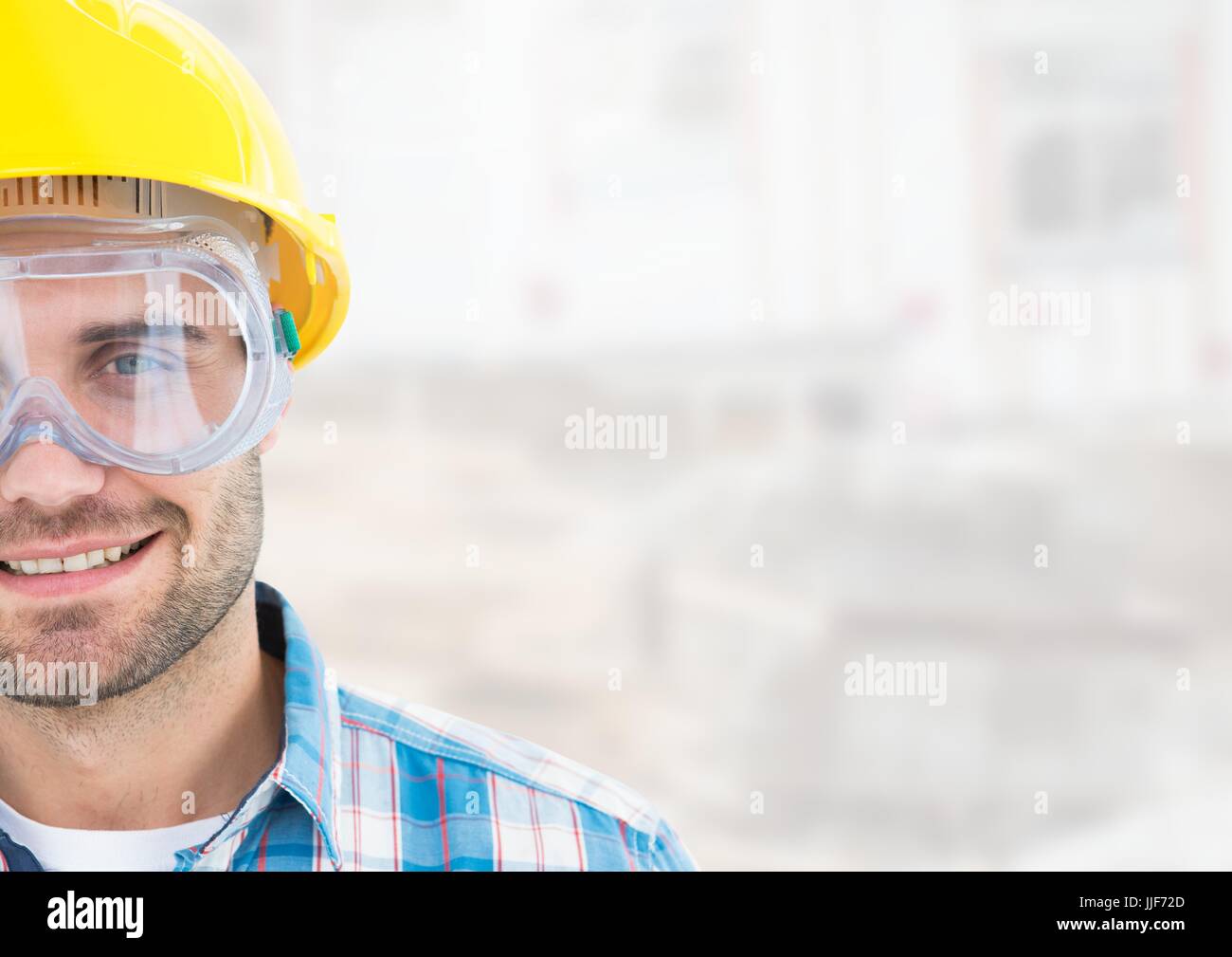Digital composite of Construction Worker with eye protection goggles in ...