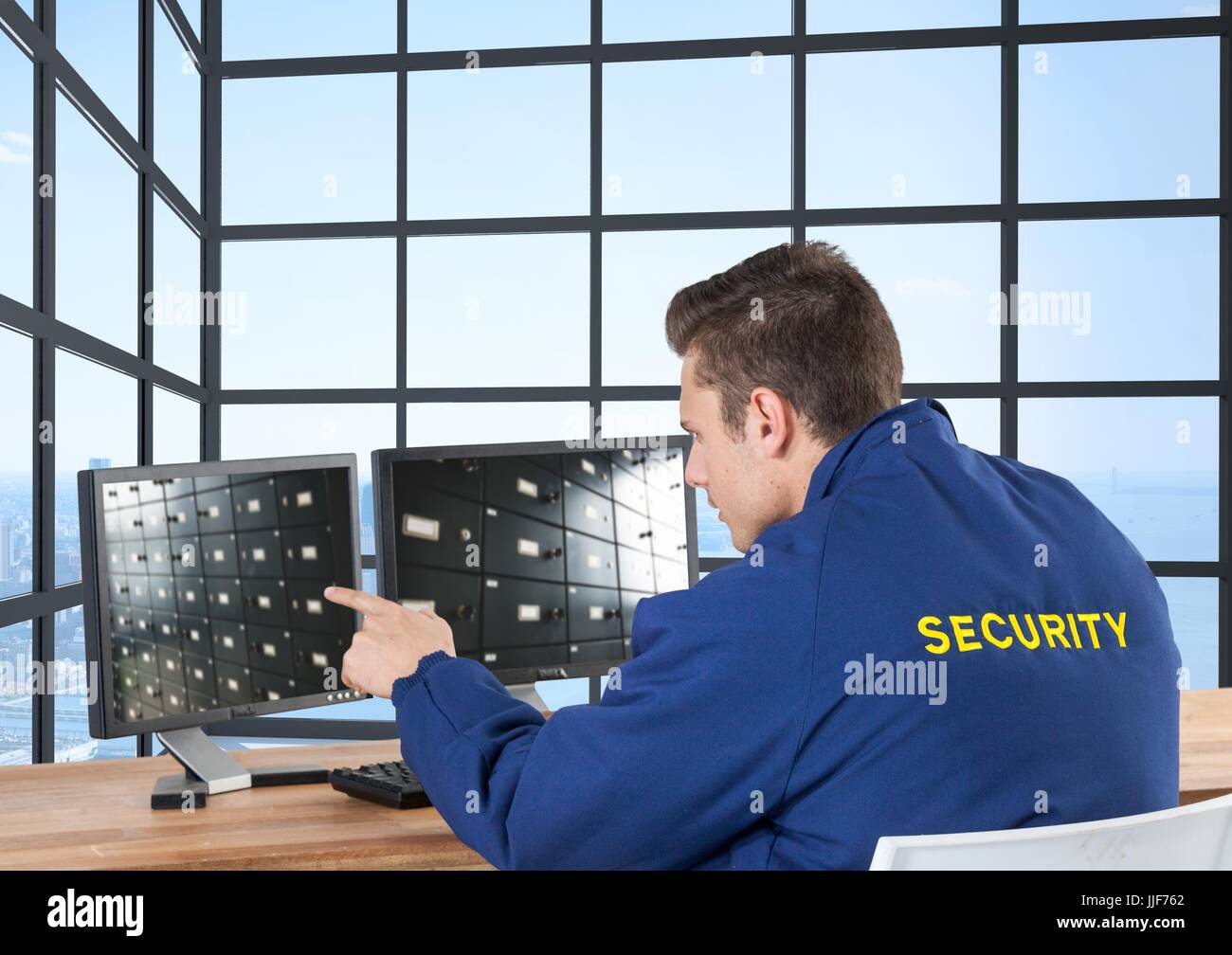 Digital composite of security guard looking the image of the security ...