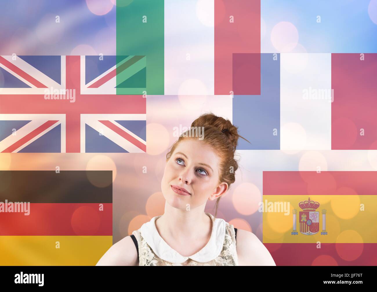 Digital composite of main language flags with opacity around young ...