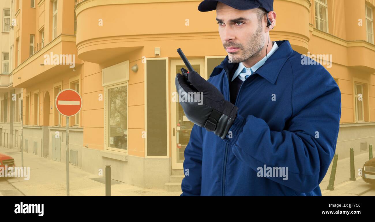 Digital composite of Security guard holding walkie talkie while ...