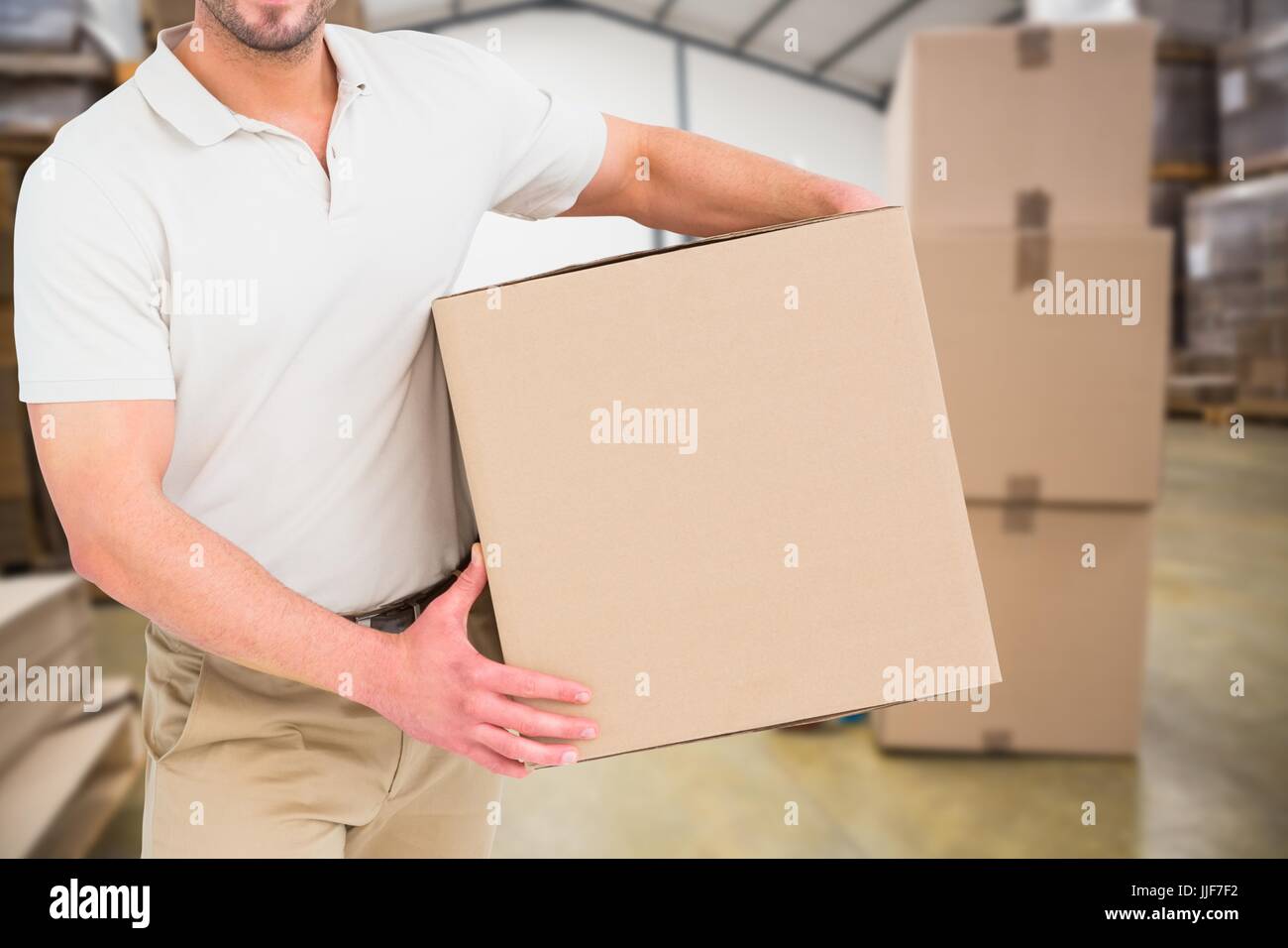 Digital composite of delivery man in warehouse Stock Photo - Alamy
