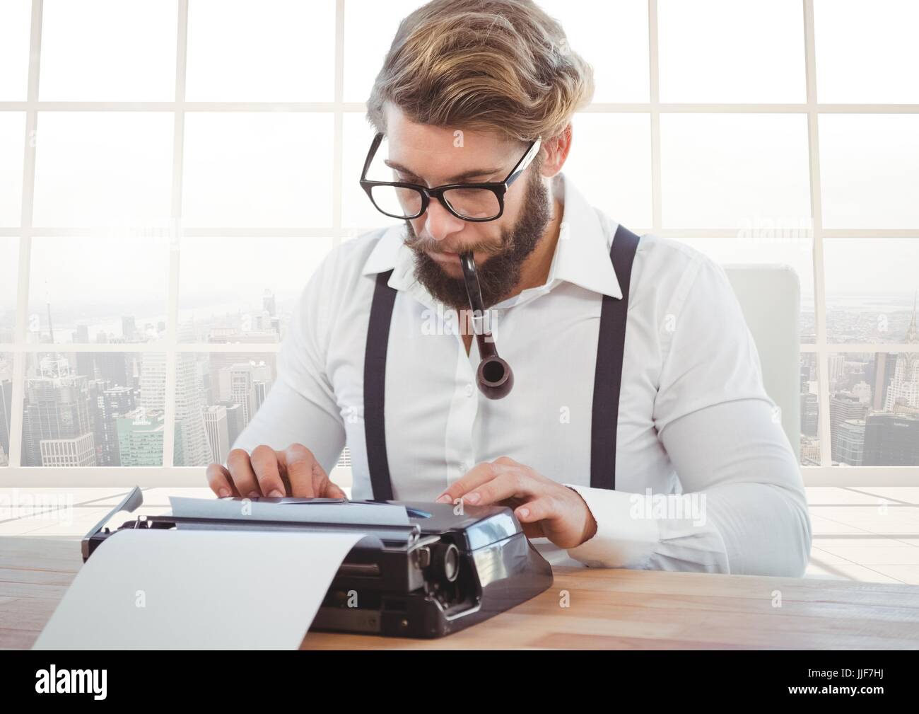 Digital composite of Hipster man on typewriter with bright windows ...