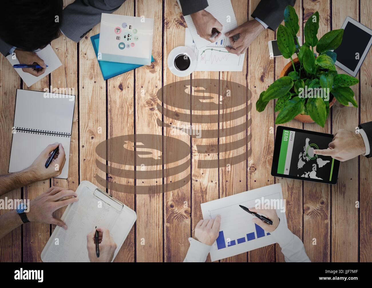 Digital composite of Overhead of hands writing with wood panel and ...