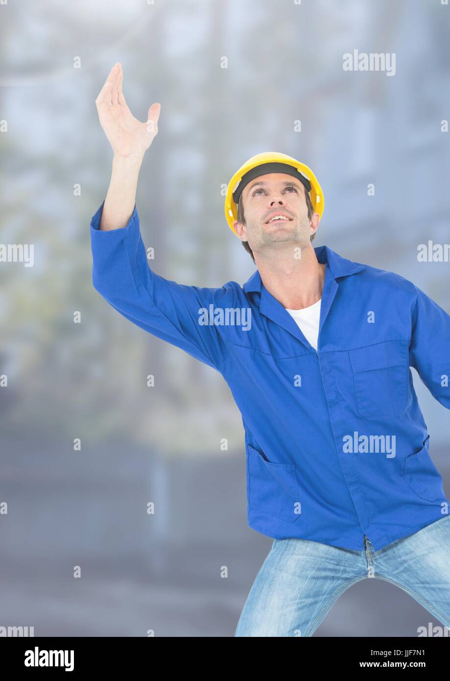 Digital composite of Construction Worker in front of construction site ...