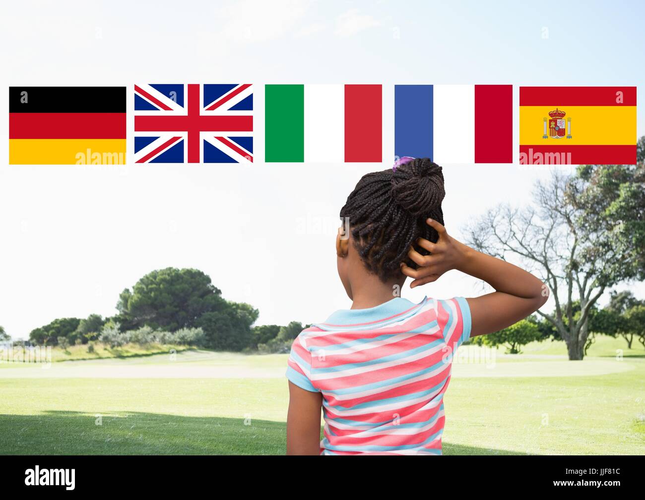 Digital composite main language flags over girl hi-res stock ...