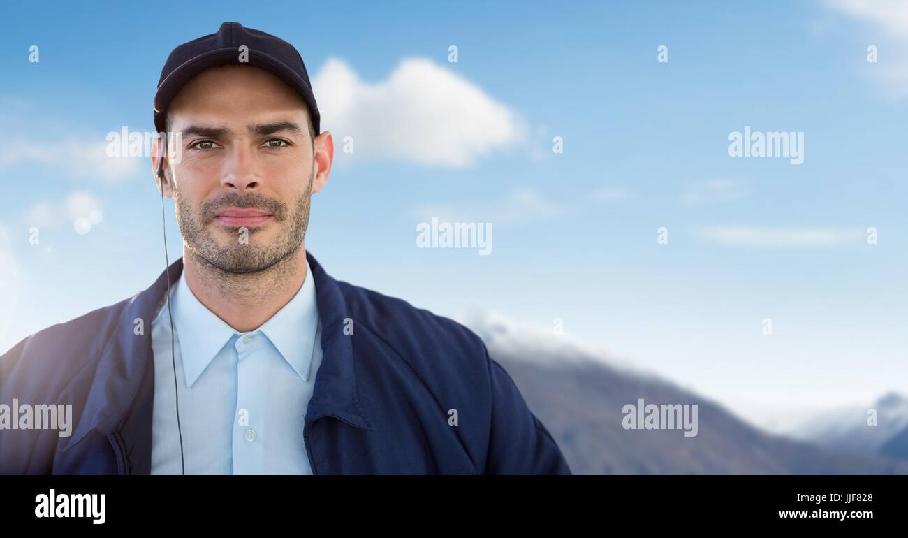 Digital composite of Security man with hat and sky Stock Photo - Alamy