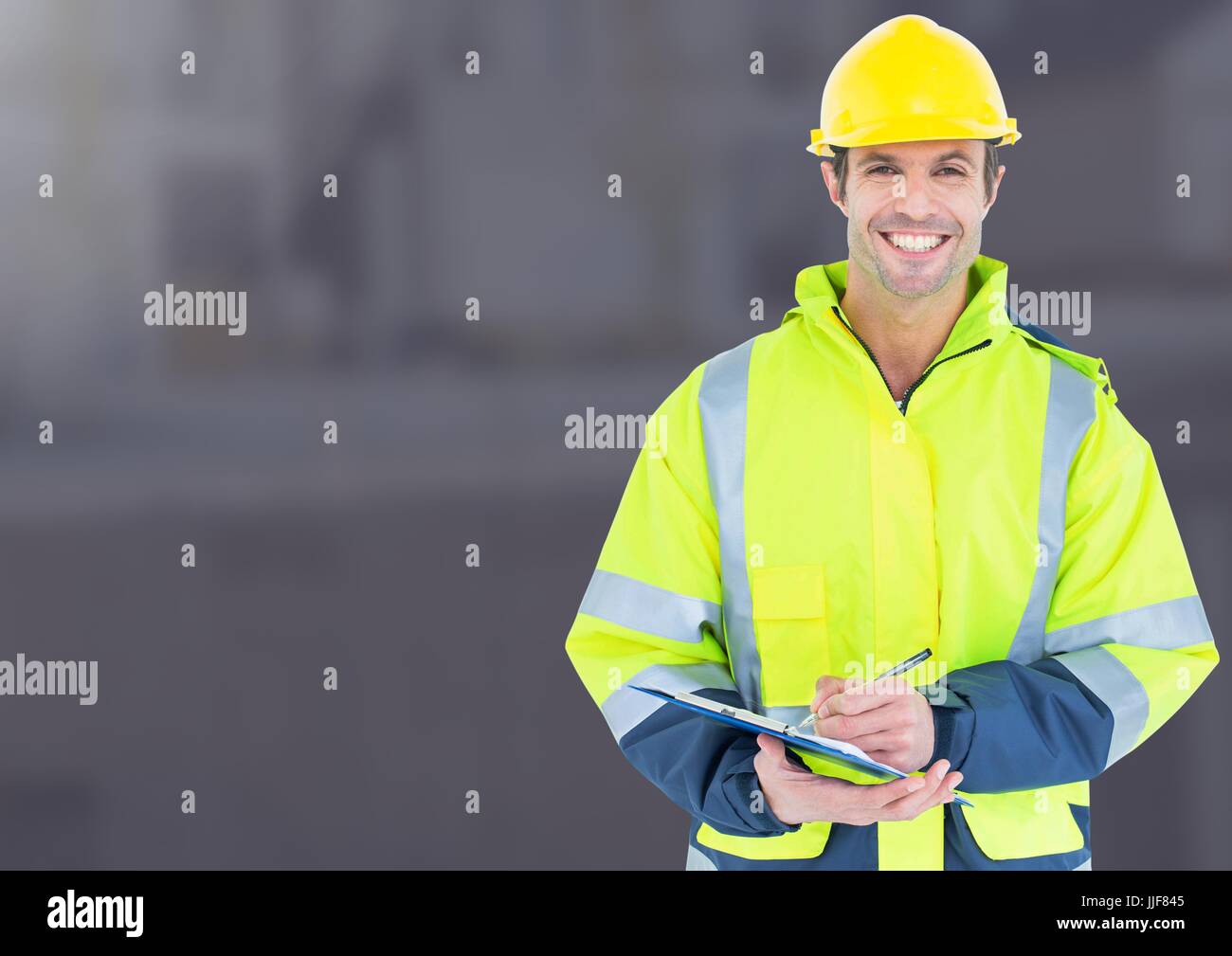 Digital composite of Construction Worker in front of construction site ...