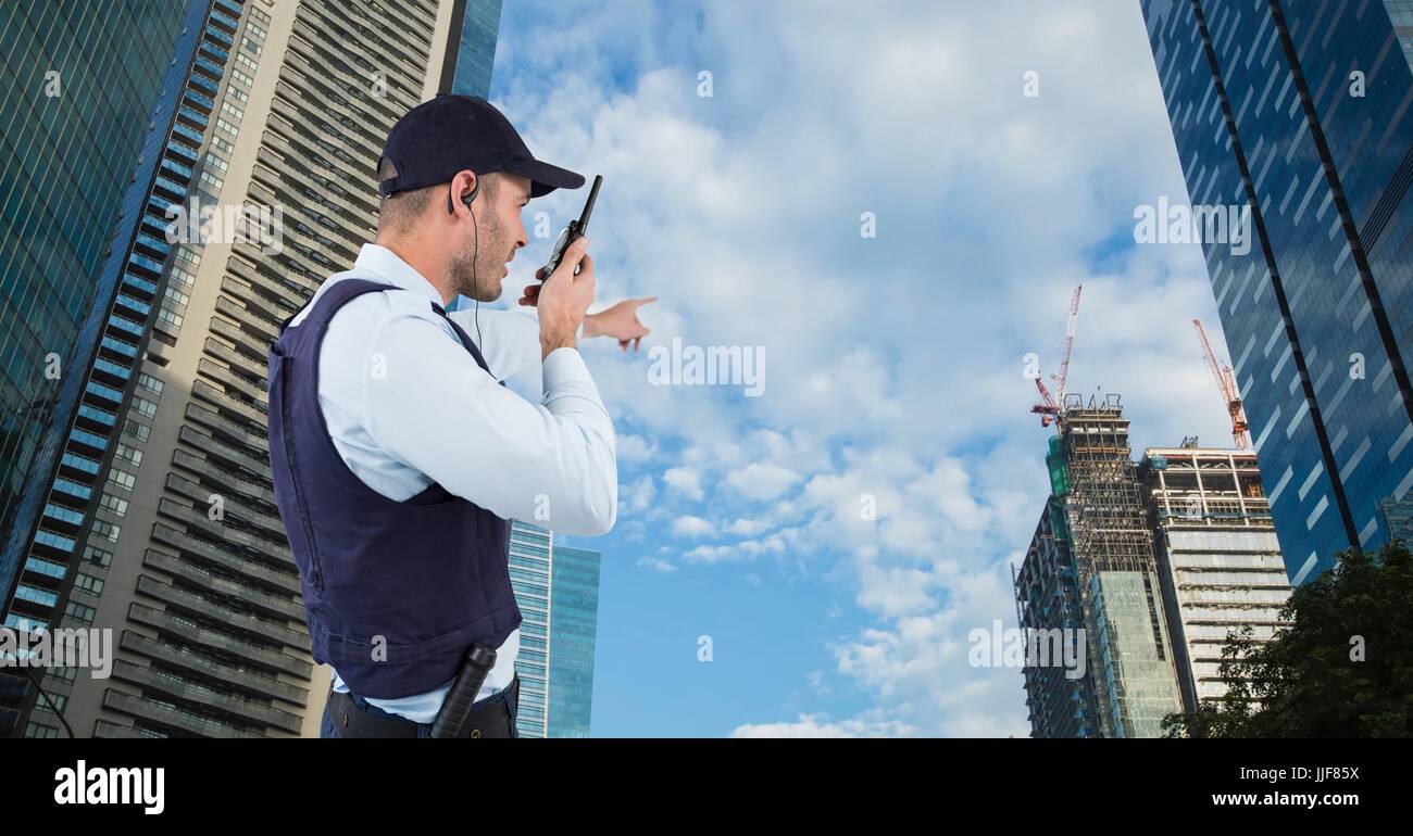 Digital composite of Security guard talking on walkie talkie and ...