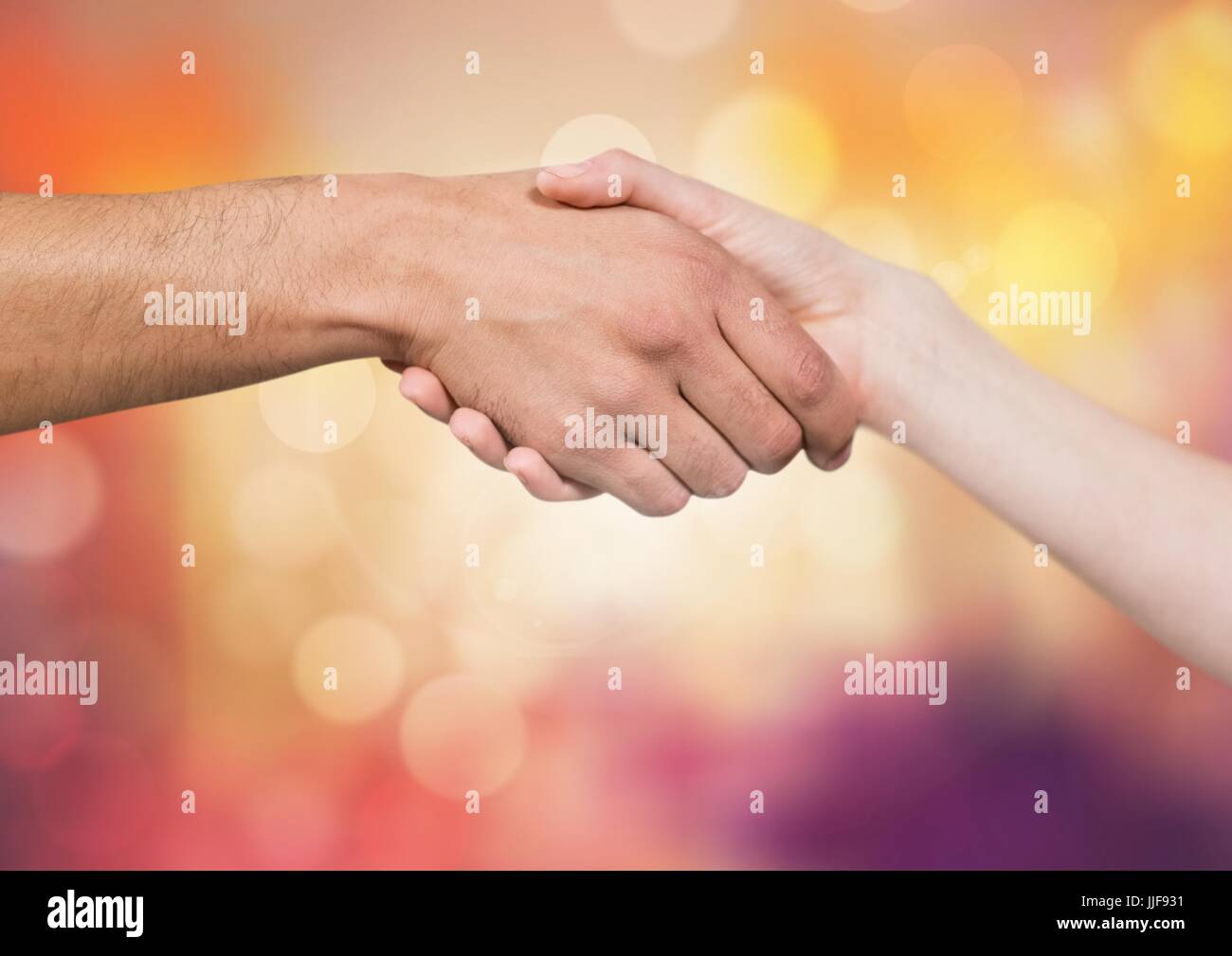 Business partners handshake glowing light hi-res stock photography and ...
