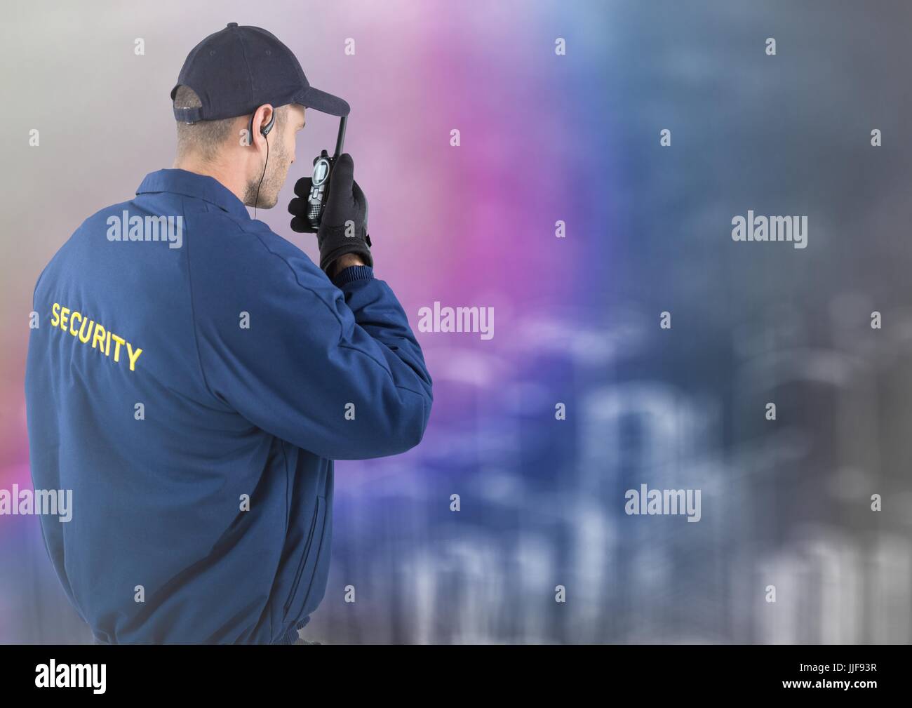 Digital composite of Back of security guard with walkie talkie against ...