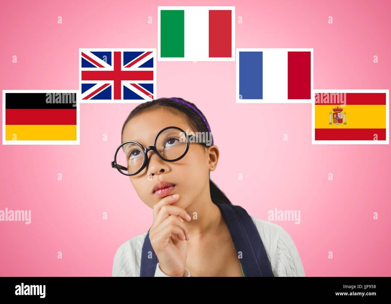 Digital composite of main language flags around girl. Pink background ...