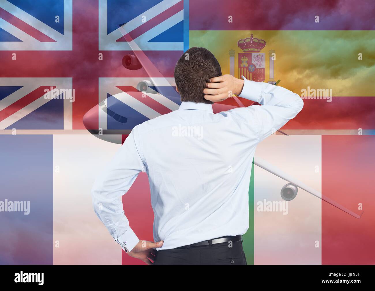 Digital composite of main language flags around man thinking. plane ...