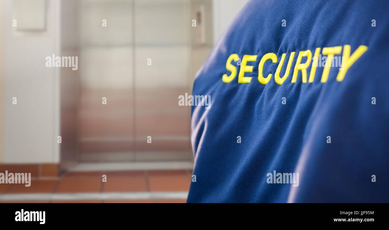 Digital composite of Security man outside lift door Stock Photo - Alamy