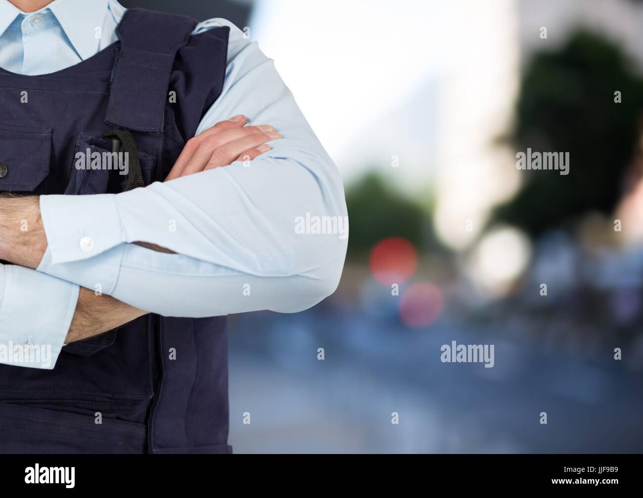 Digital composite of security guard hands folded in the street Stock ...