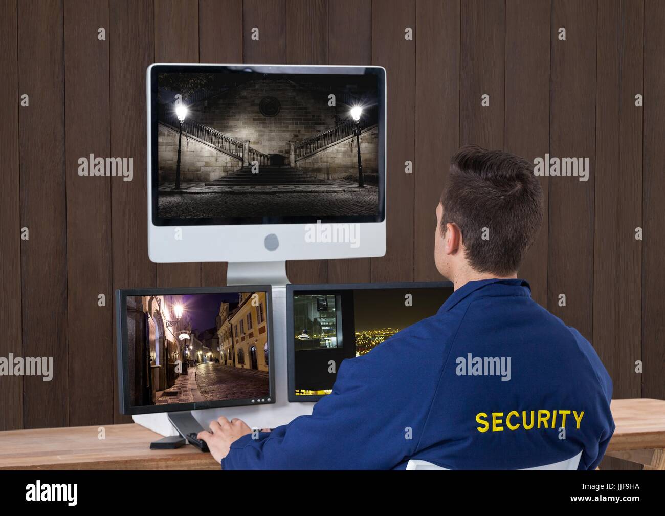 Digital composite of security guard with his technology Stock Photo - Alamy