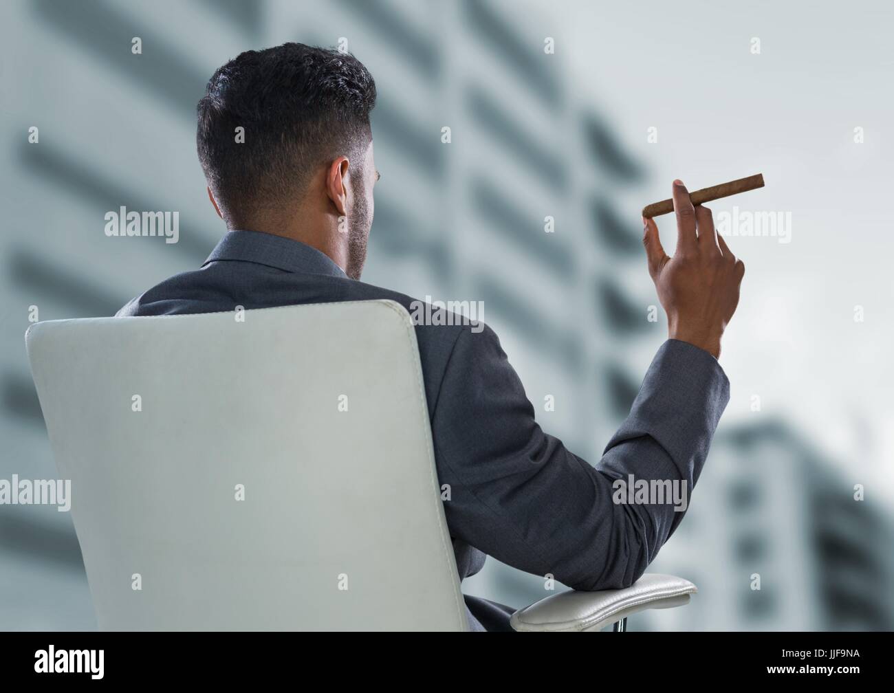 Young man seated low chair hi-res stock photography and images - Alamy