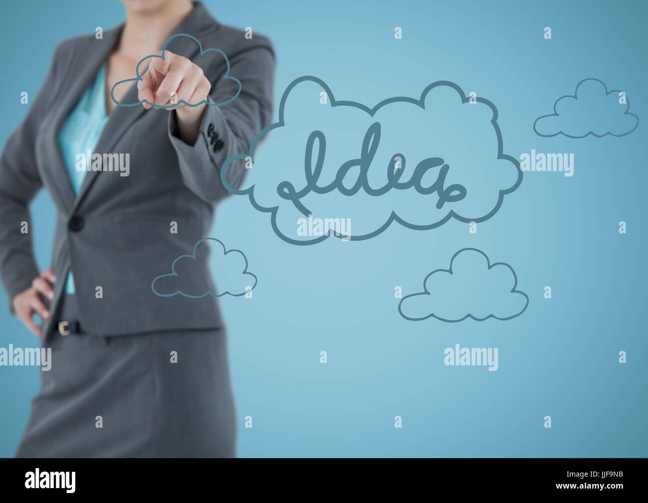 Digital composite of Business woman mid section pointing at blue idea ...