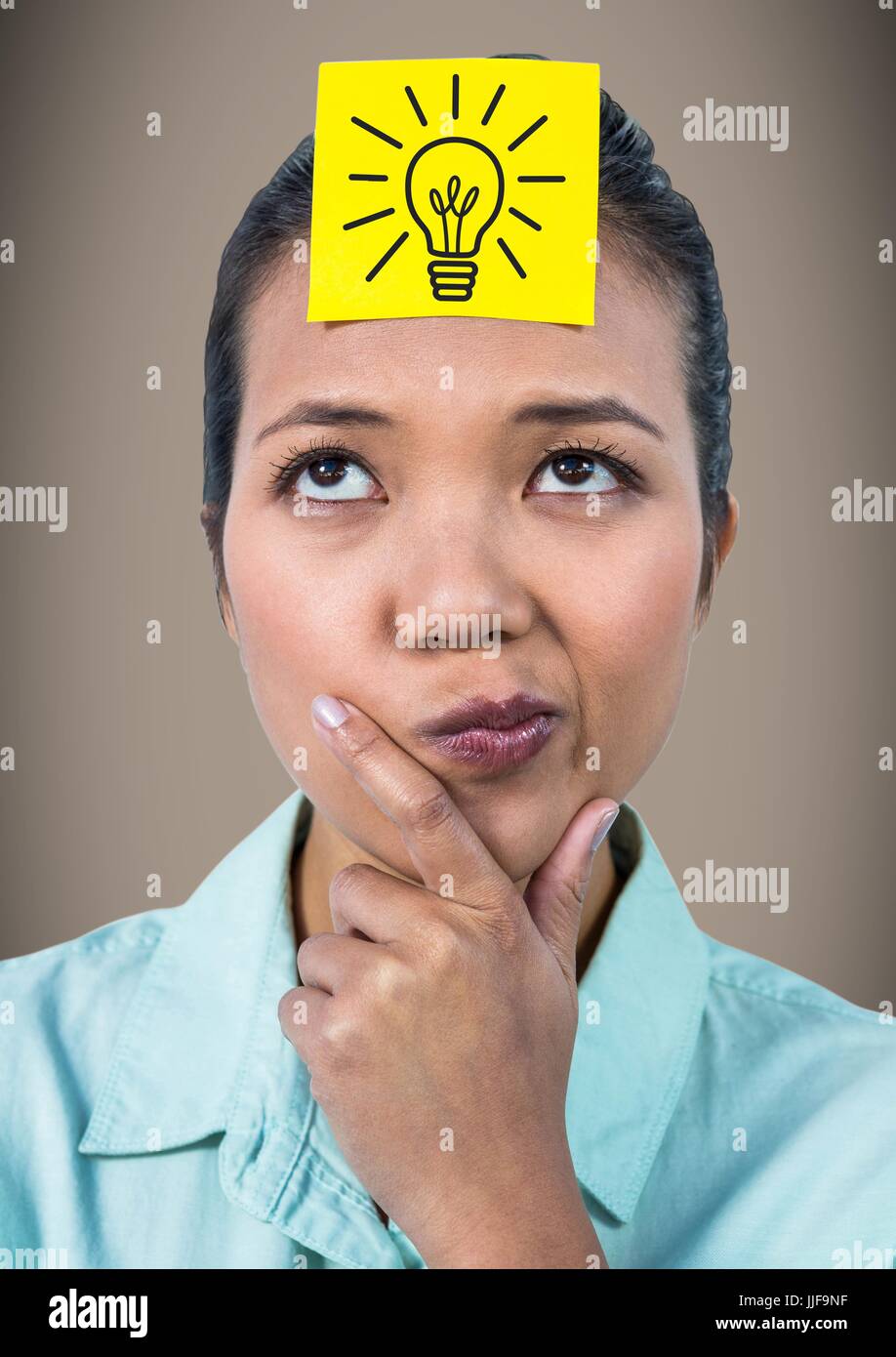 Digital composite of Woman thinking with yellow sticky note on head ...