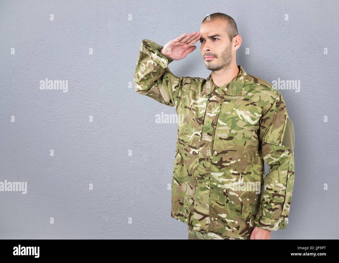 Digital composite of soldier saluting. concrete wall Stock Photo - Alamy