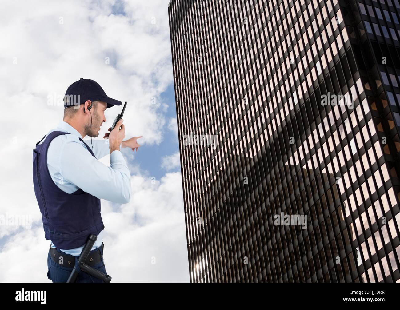 Digital composite of Security guard talking on walkie talkie while ...