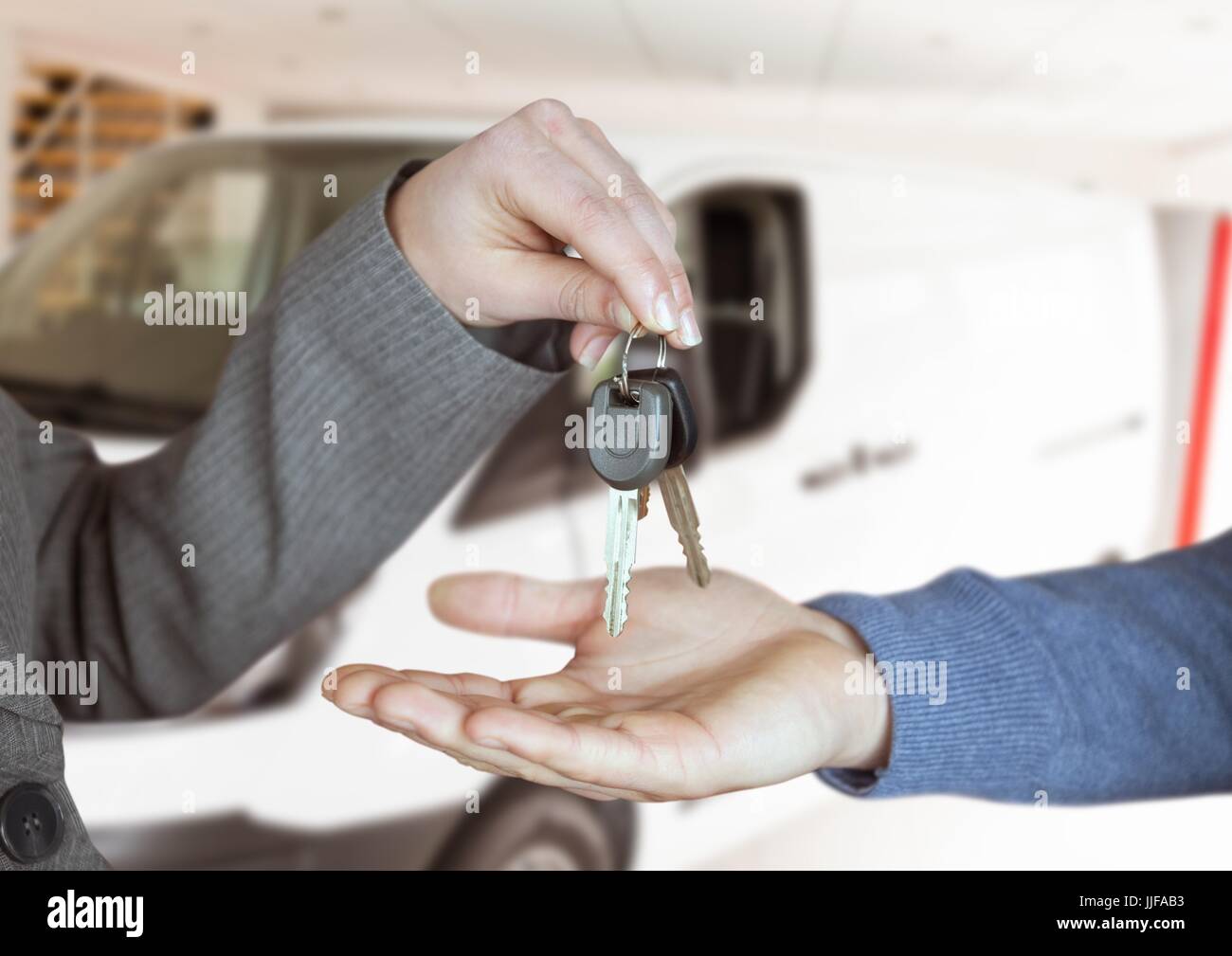 Digital composite of giving keys of the car after handshake Stock Photo ...