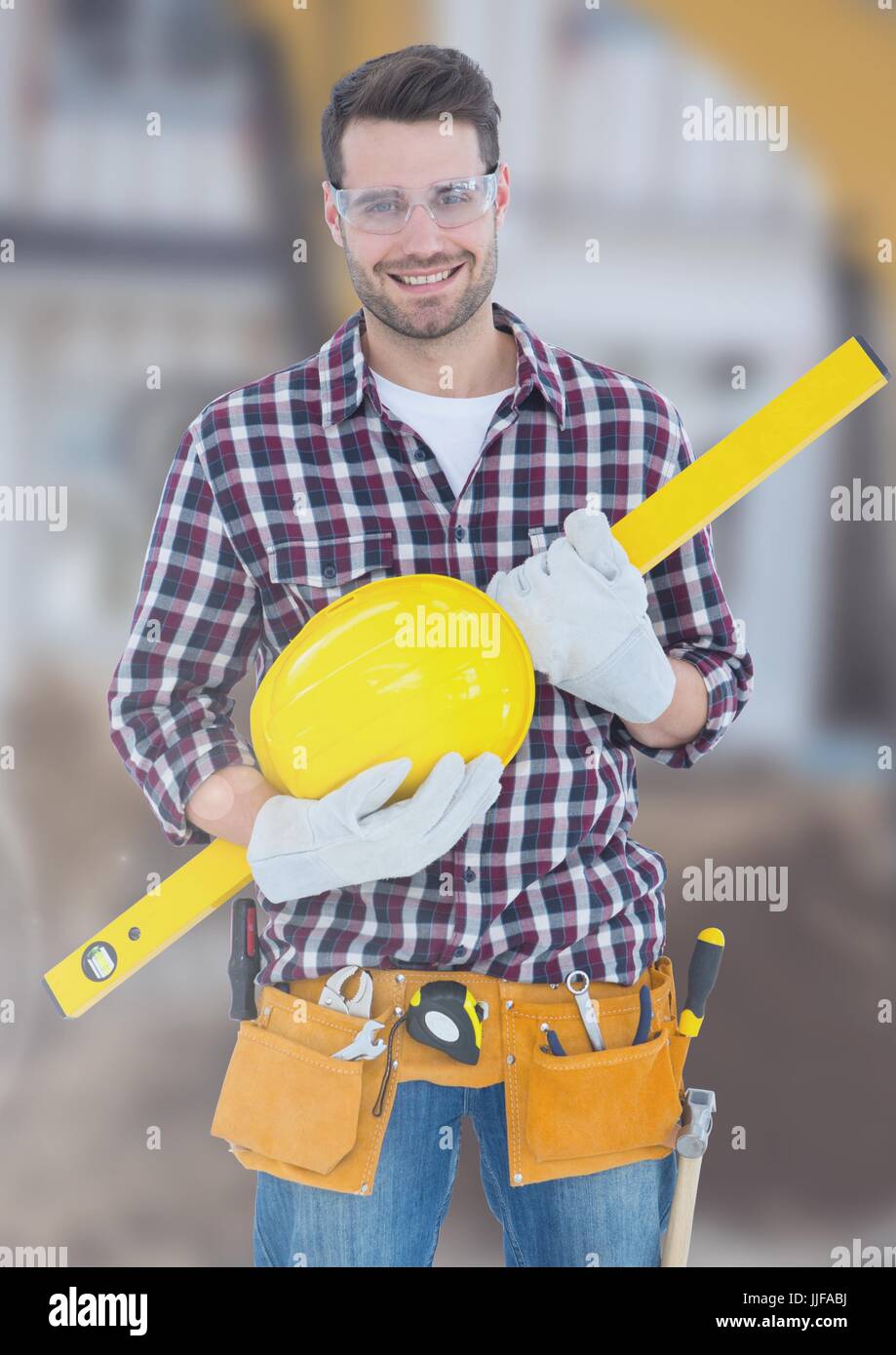 Digital composite of Construction Worker with spirit level in front of ...