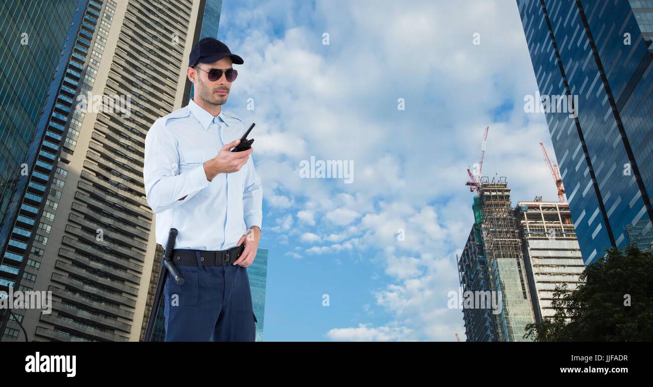 Digital composite of Security guard holding walkie talkie while ...