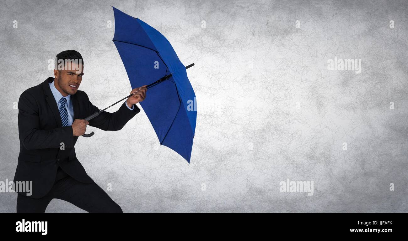 Digital composite of Business man blocking with umbrella against white ...
