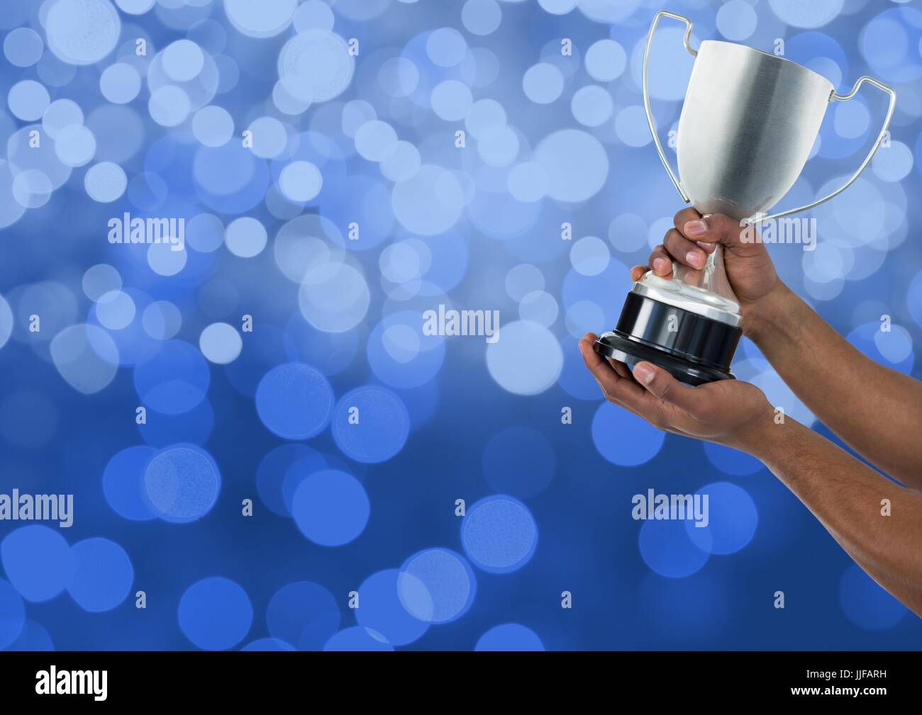 Standing holding trophy achievement holding hands hi-res stock ...