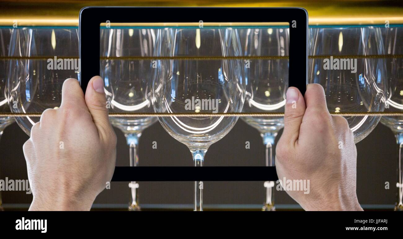 Digital composite of Hands photographing wine glasses through digital ...