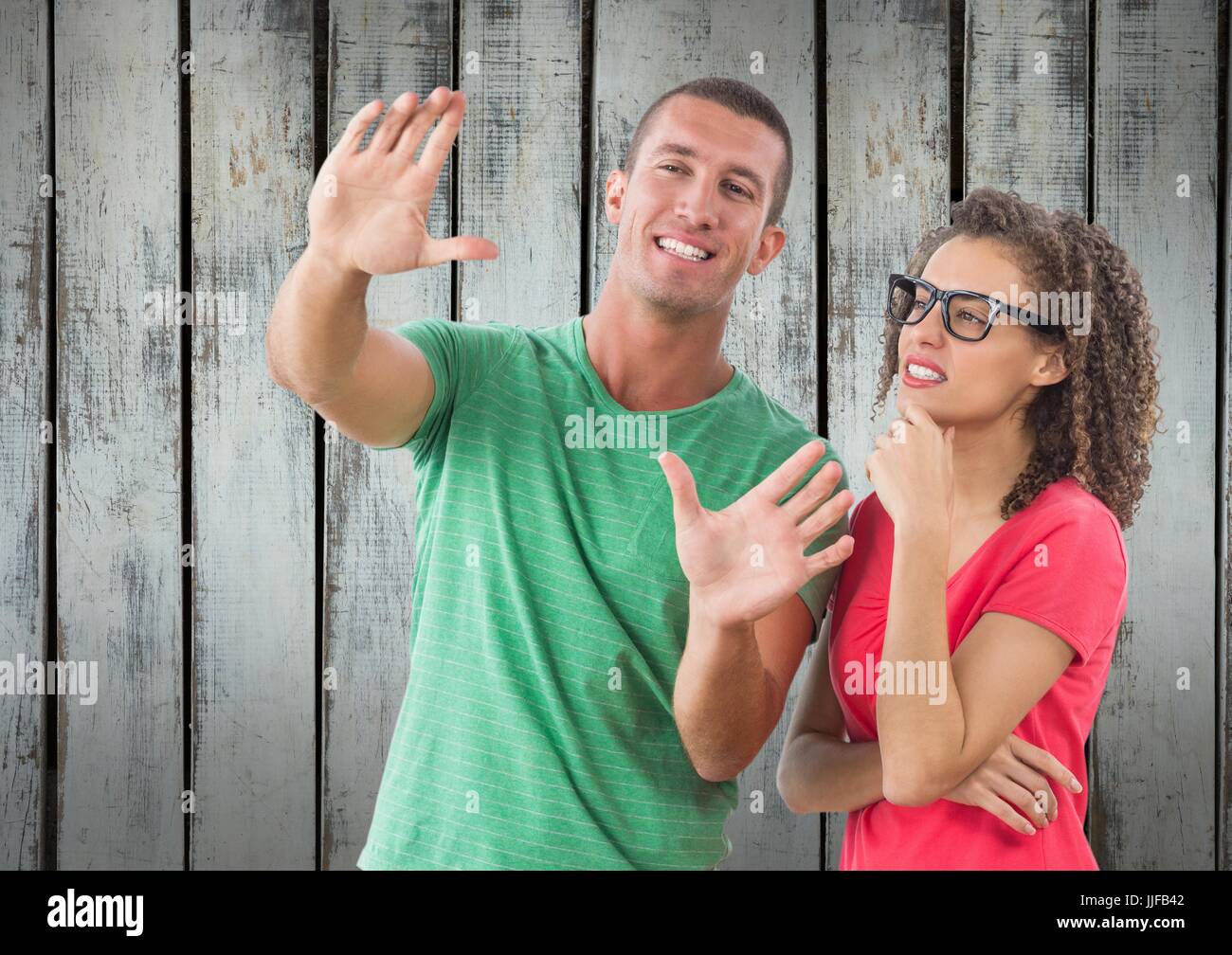 Digital composite of A man showing something to a girl in front of wood ...