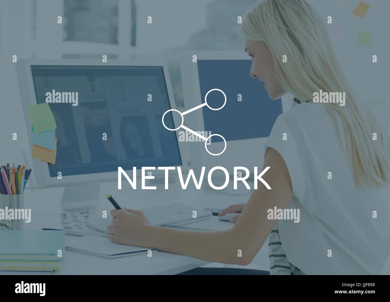 Digital composite of Network text against woman with graphics tablet at ...